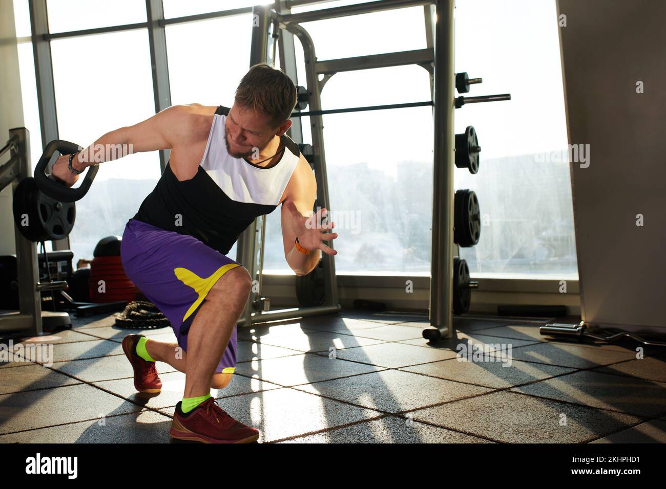 Handsome Athletic Men Exercising With Kettlebell in the gym Stock Photo ...