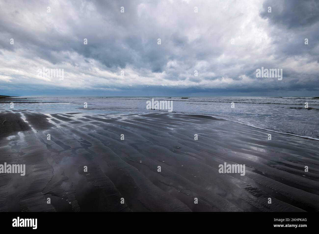 An aerial view of sea waves breaking sandy beach Stock Photo - Alamy