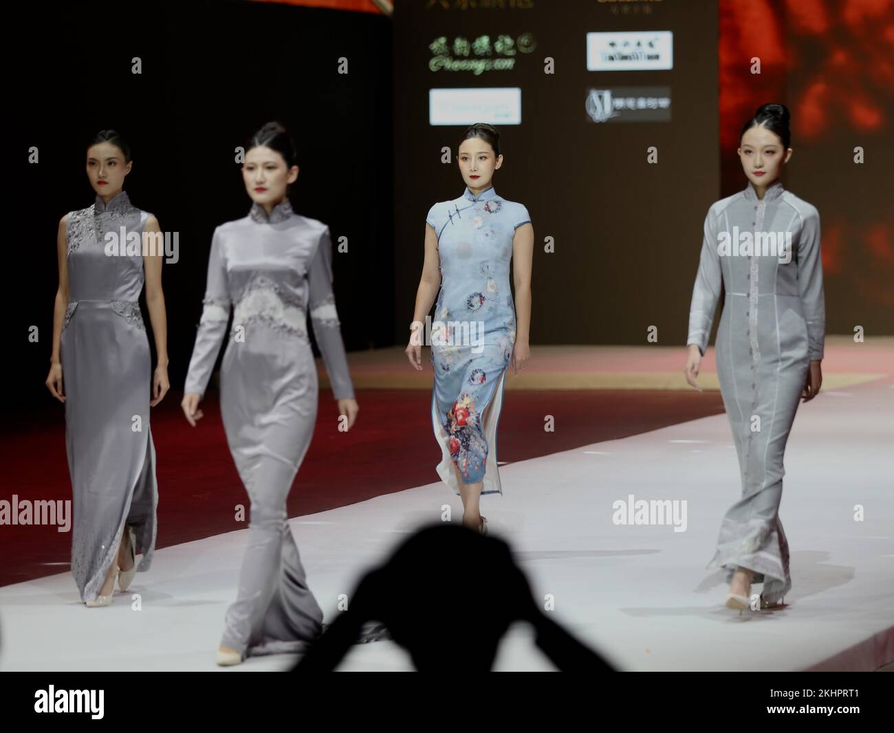 Models wearing cheongsam displayed on the catwalk at the Closing ...