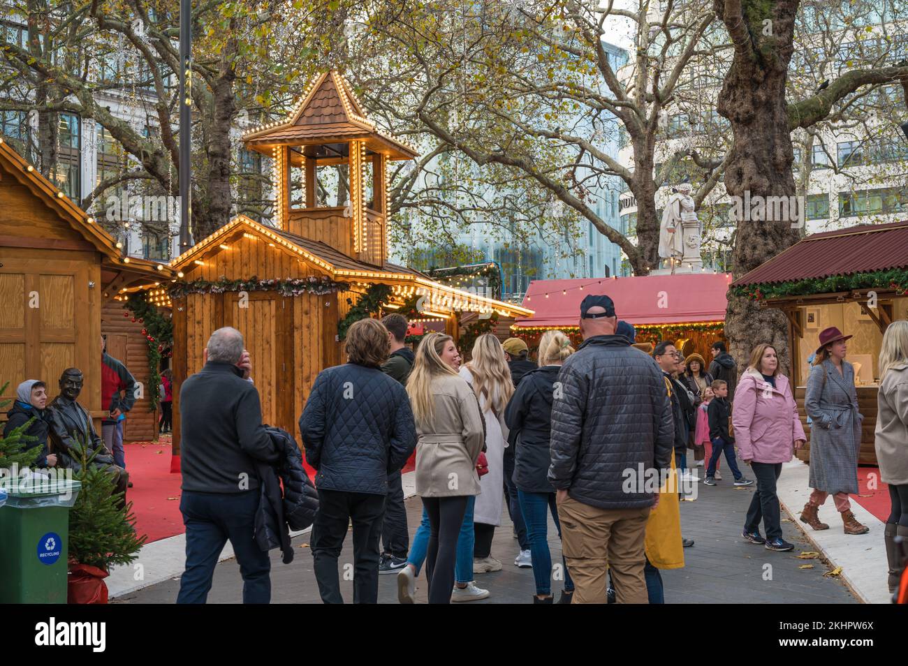 People visiting the outdoor Christmas market in Leicester Square ...