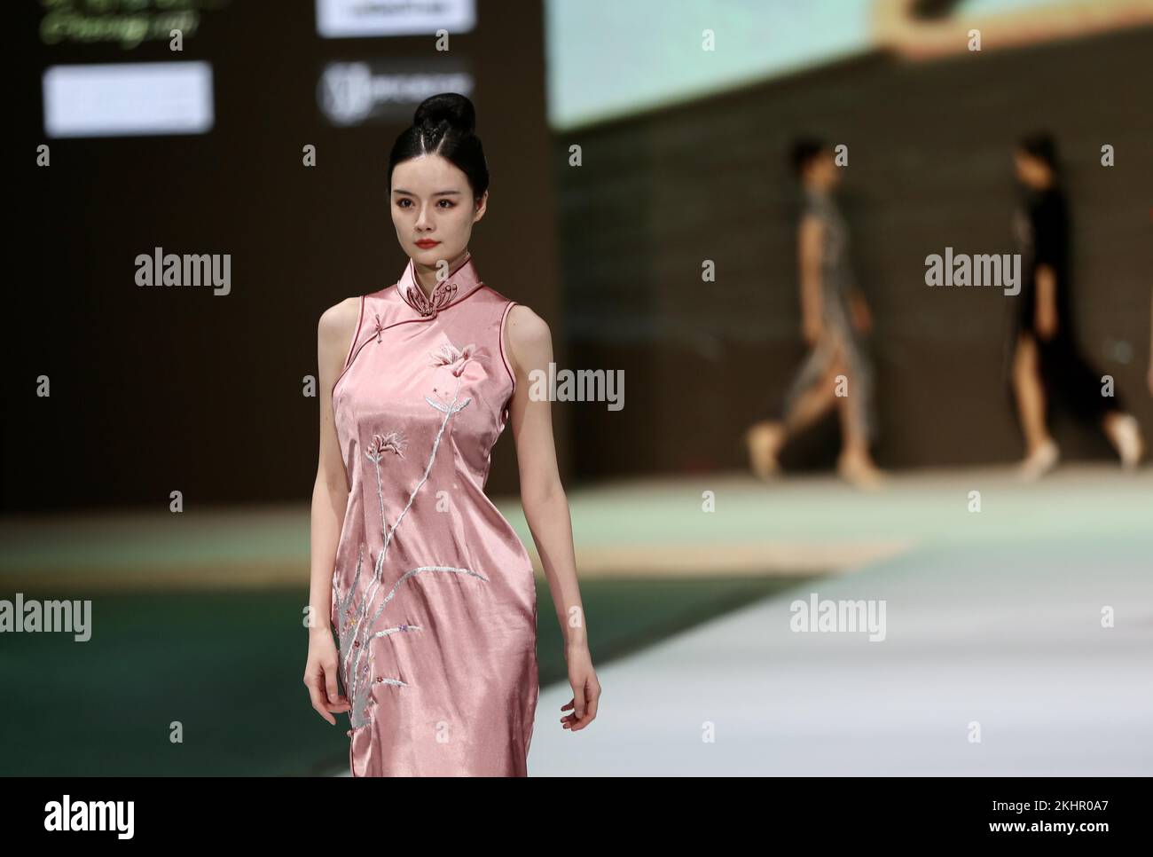 Models wearing cheongsam displayed on the catwalk at the Closing ...