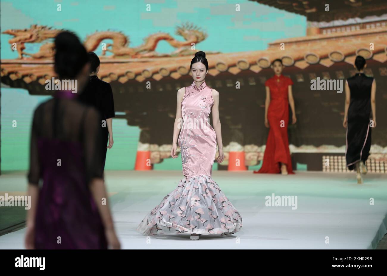 Models wearing cheongsam displayed on the catwalk at the Closing ...