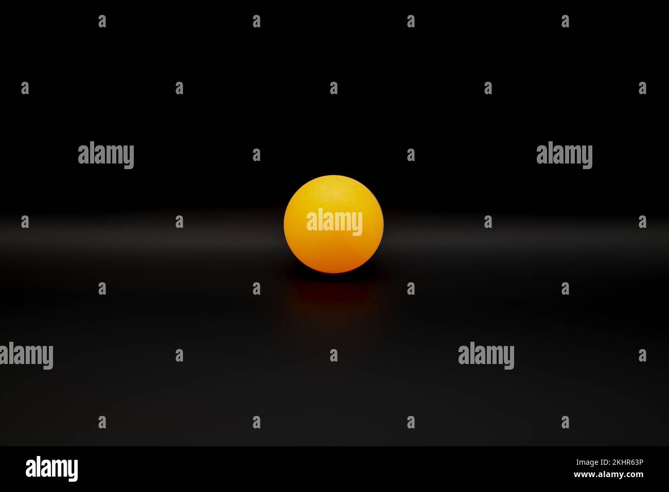 A beautiful closeup of a ping pong ball isolated on black background ...