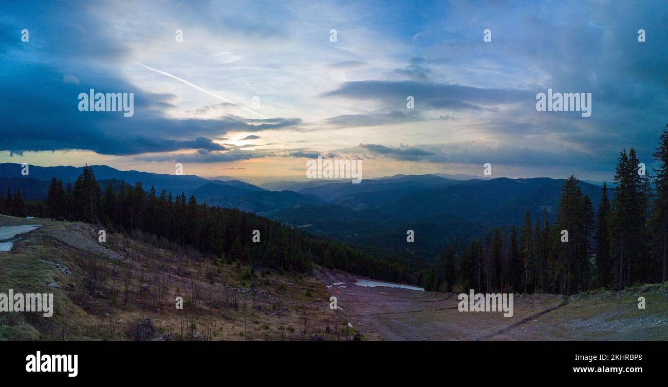Valley of Balkan mountains with fog, sunny clouds and forests. Village ...