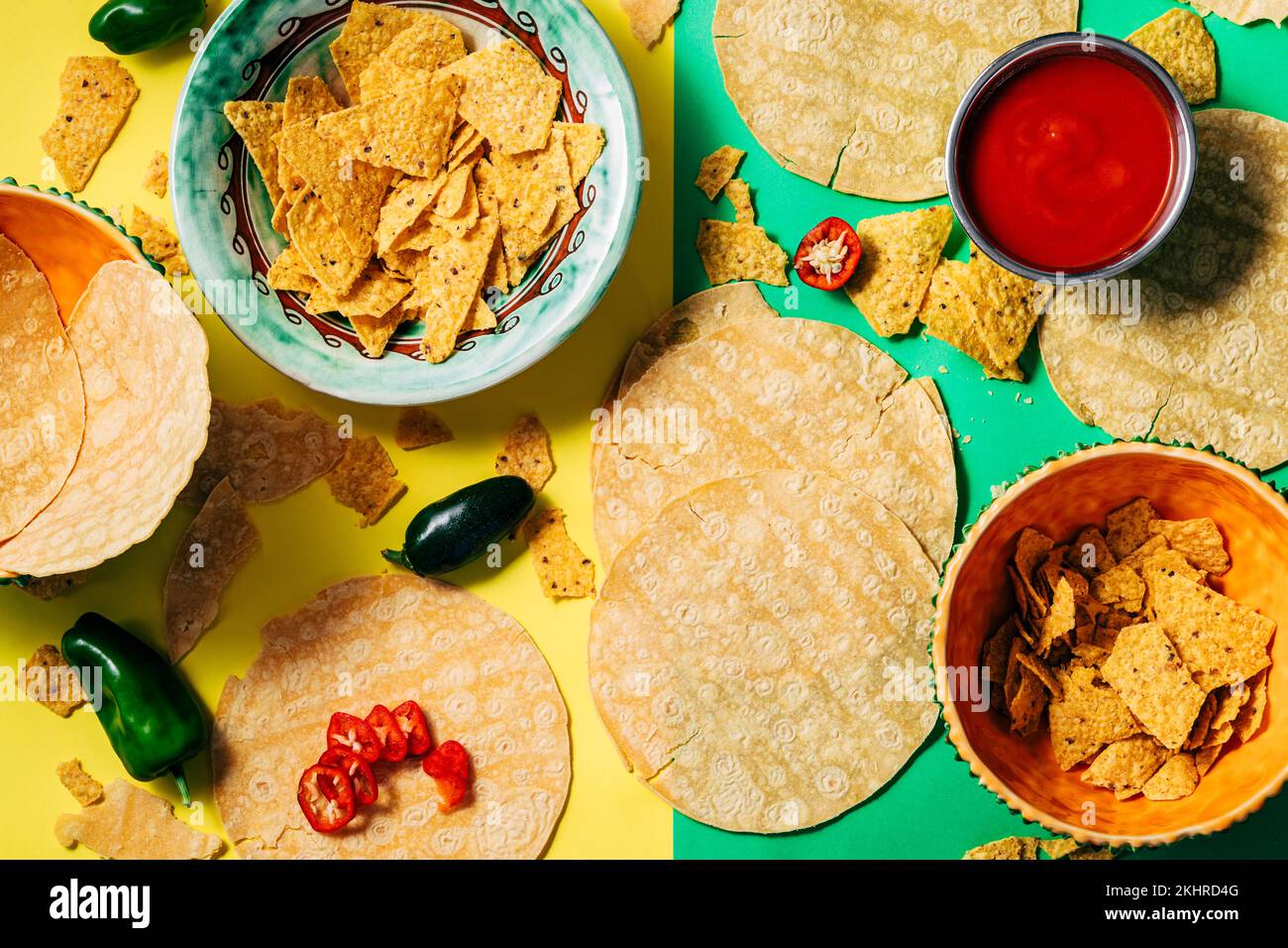 Colorful Mexican food with tortilla chips. Jalapenos hot sauce. Chili ...