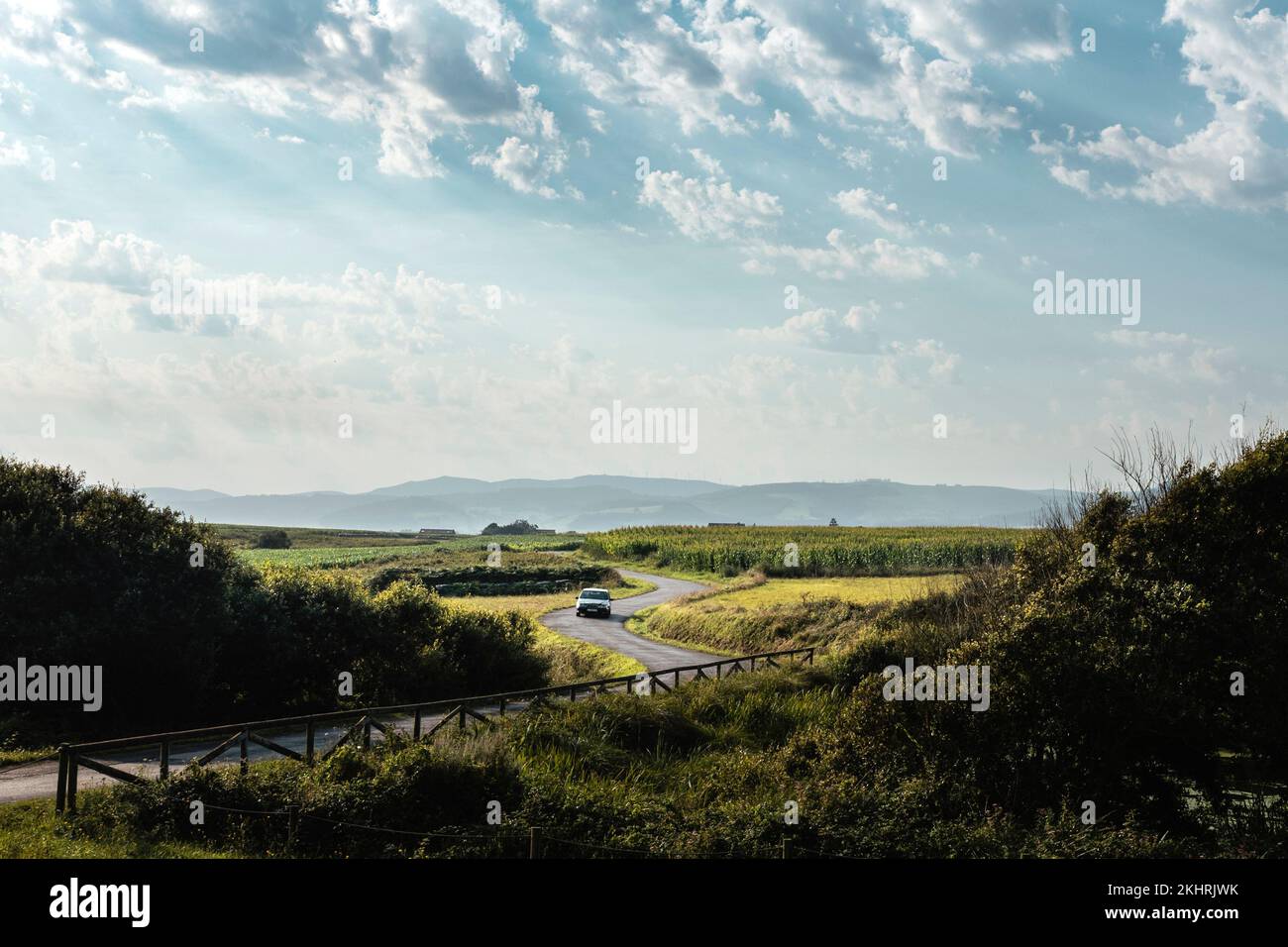 Car down snaking road hi-res stock photography and images - Alamy