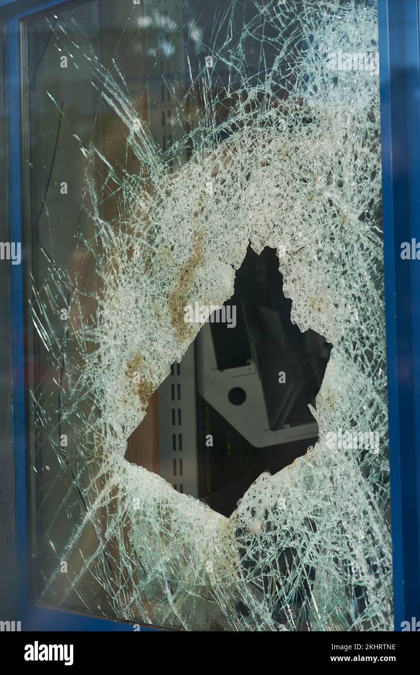 A closeup of a broken glass window, a vertical shot Stock Photo - Alamy