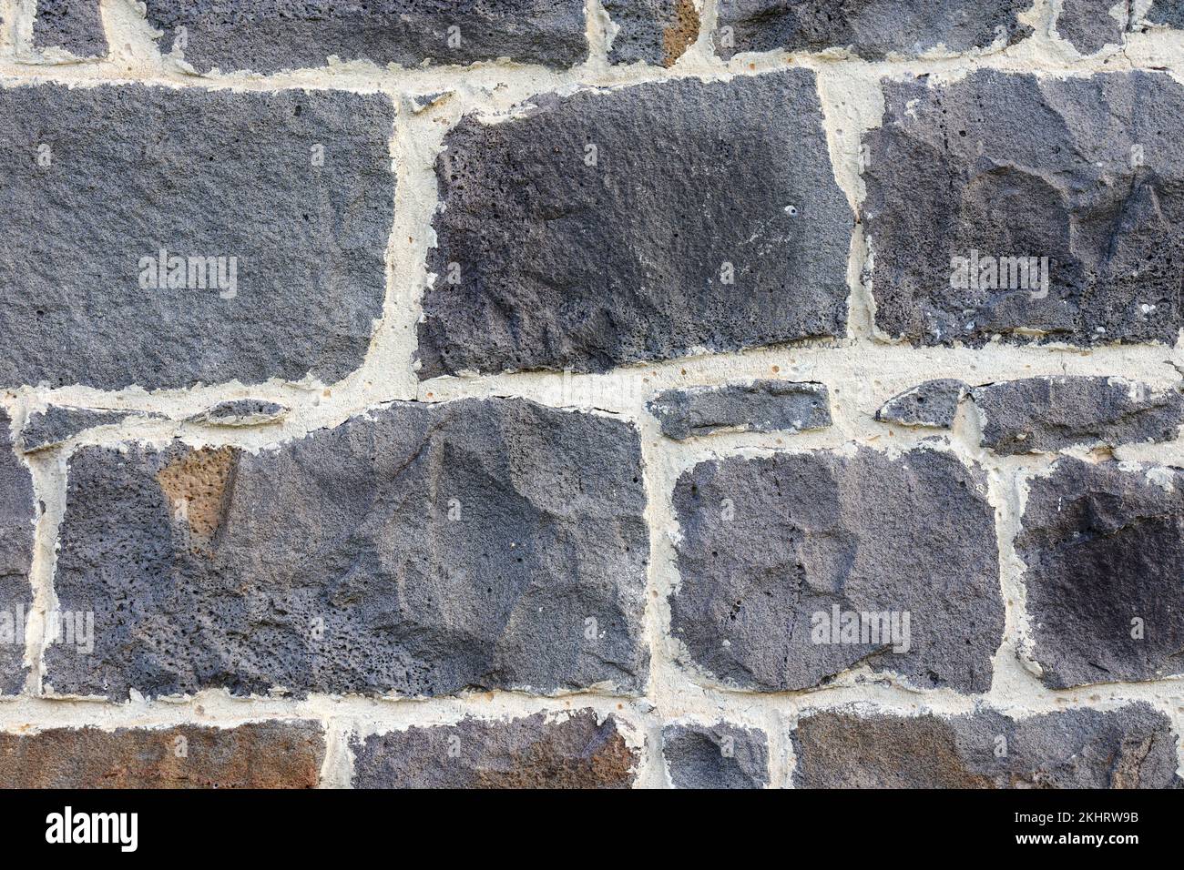 A rough bluestone wall texture with pattern Stock Photo - Alamy