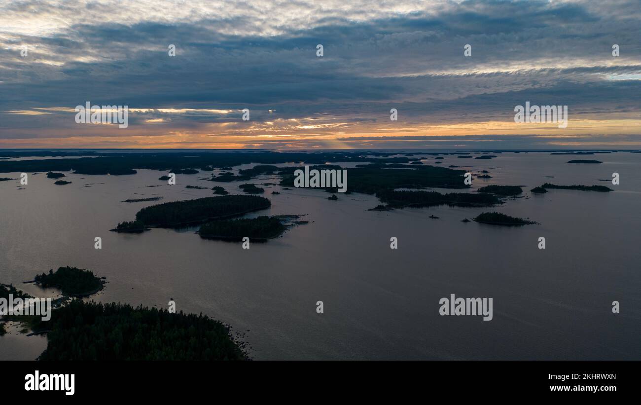 An aerial view of Finnish Archipelago with evergreen trees under the ...