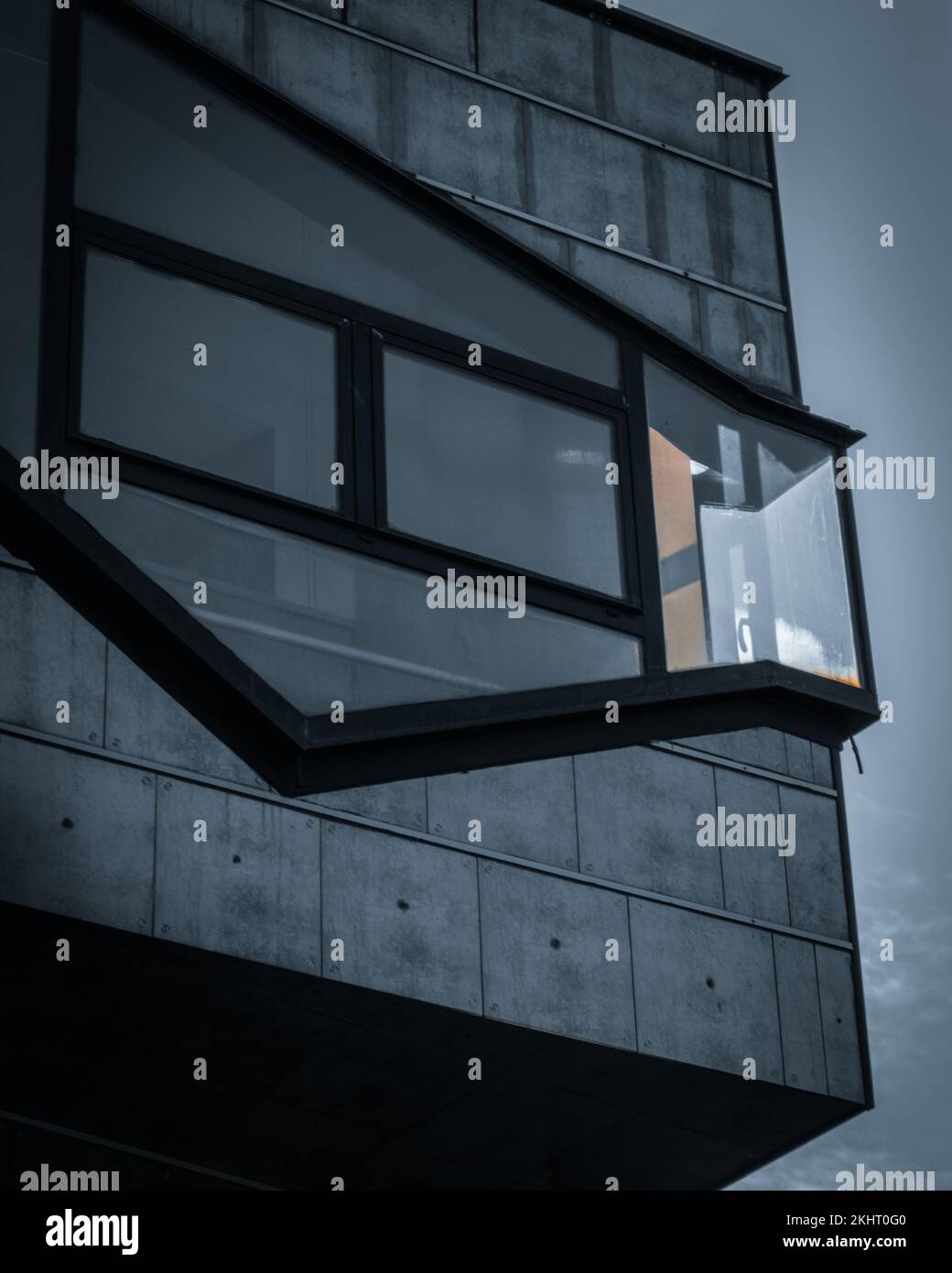 A vertical shot of wall and windows of a modern well-designed building ...