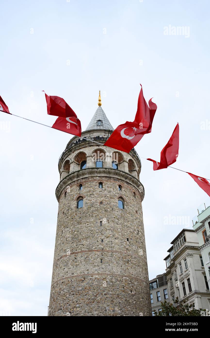 (Selective focus, focus on the Tower) Blurred Turkish National Flags in the foreground with the ...