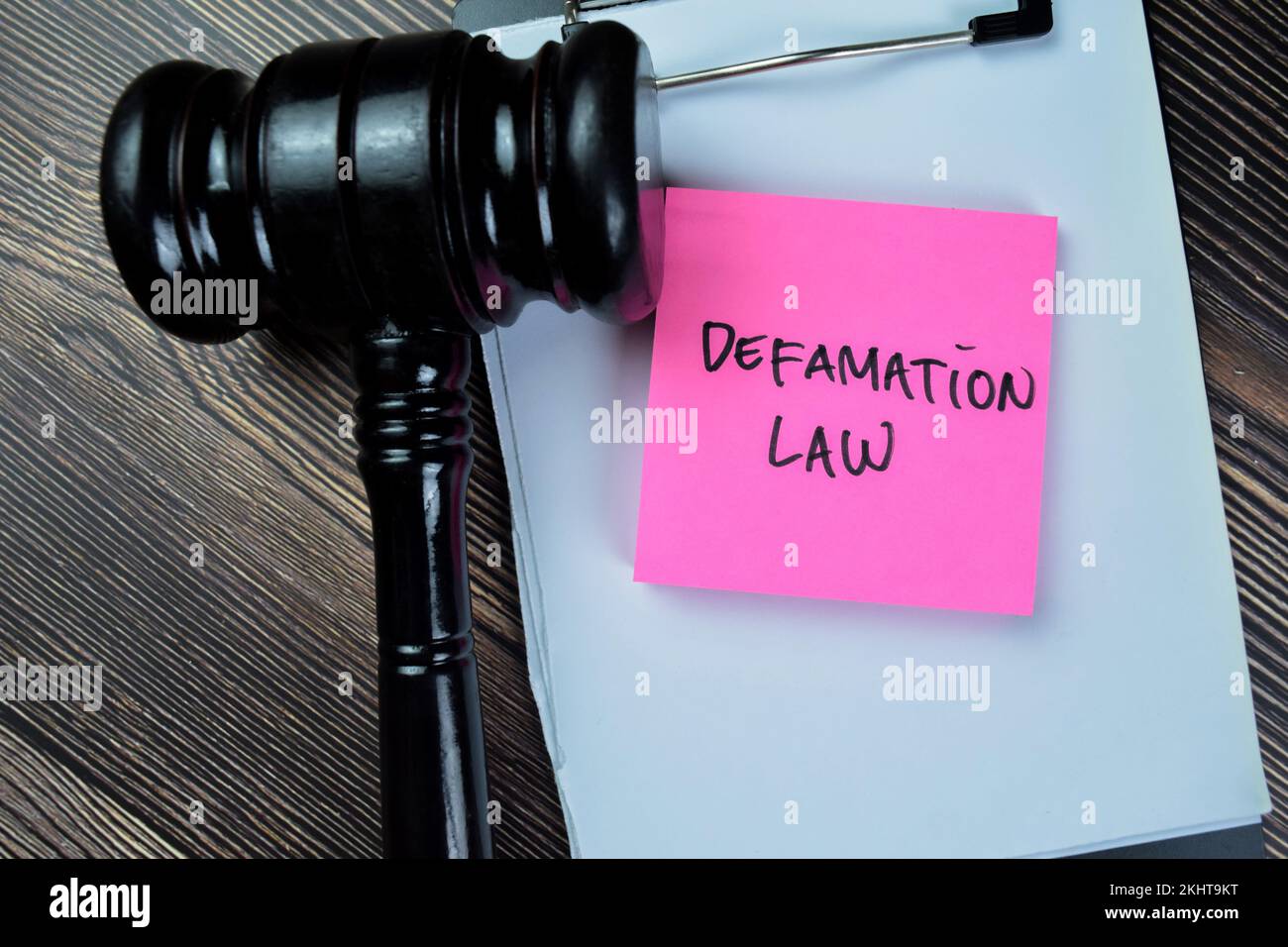 Concept of Defamation Law write on sticky notes with gavel isolated on ...