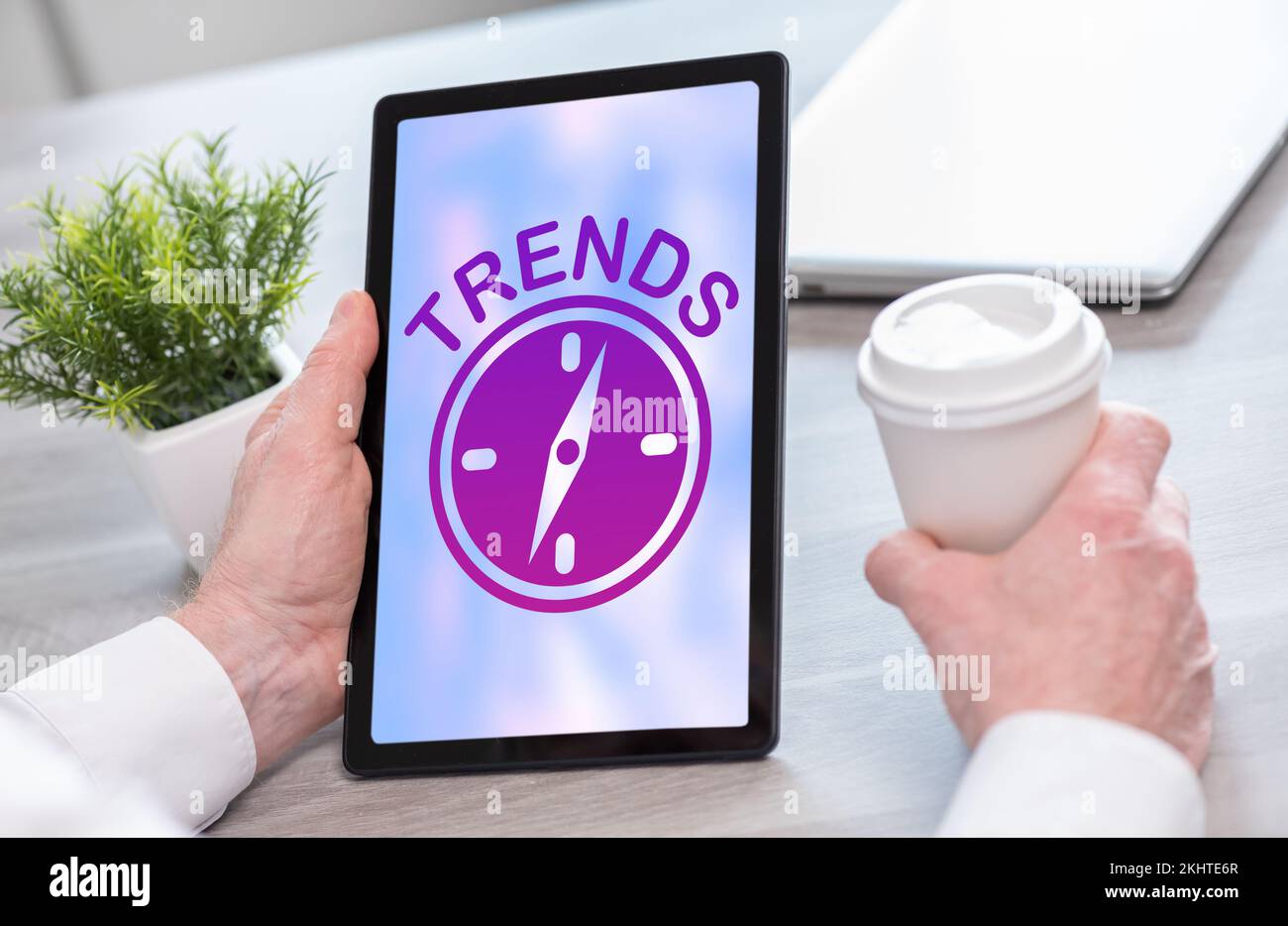 Tablet screen displaying trends hi-res stock photography and images - Alamy
