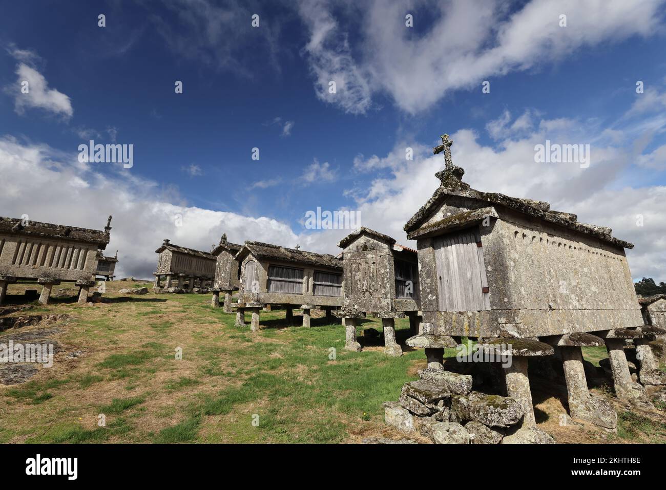 An old Granary (espigueiros) and castle above the village of Lindoso in the Parque Nacional da ...