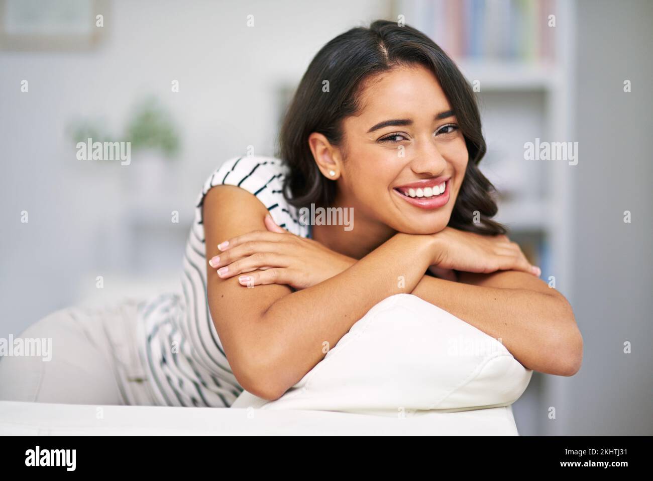 Happy woman, sofa and smile portrait in home to relax with positive ...