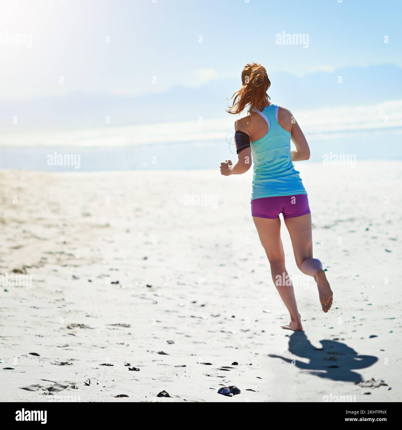 Fitness, woman and running on sandy beach for healthy exercise, workout ...