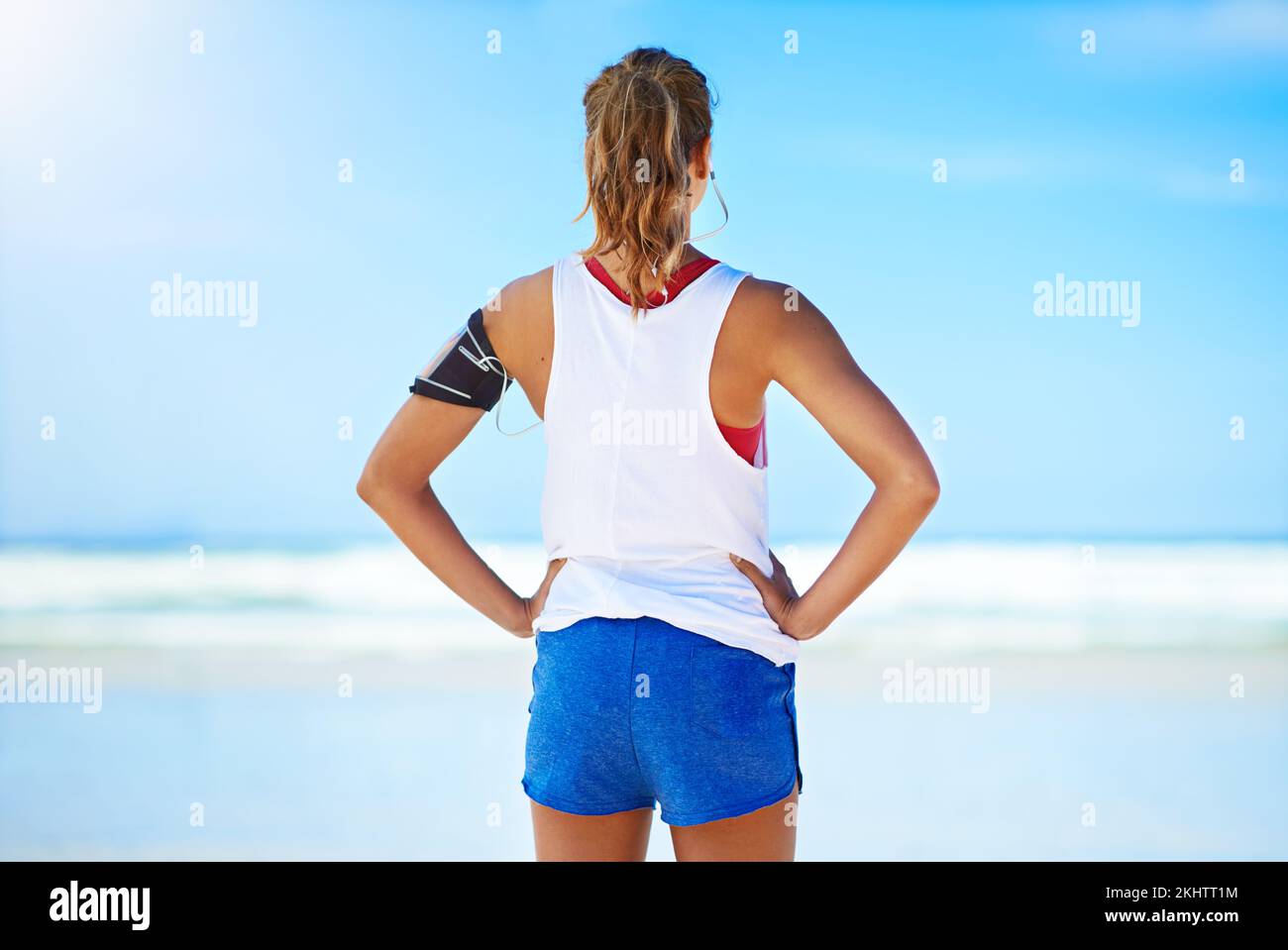 Fitness, woman runner and relax on a break at the beach for exercise ...