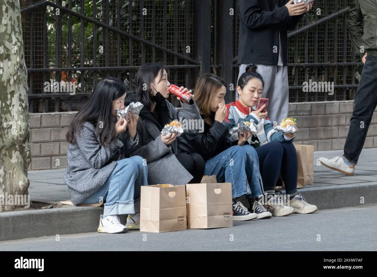SHANGHAI, CHINA - NOVEMBER 24, 2022 - Cheers Burger shoppers gather in ...