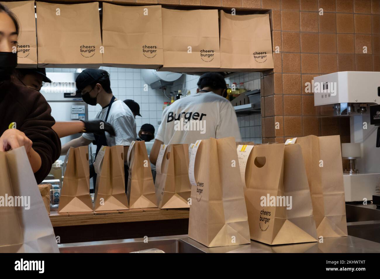 SHANGHAI, CHINA - NOVEMBER 24, 2022 - Cheers Burger shoppers gather in ...