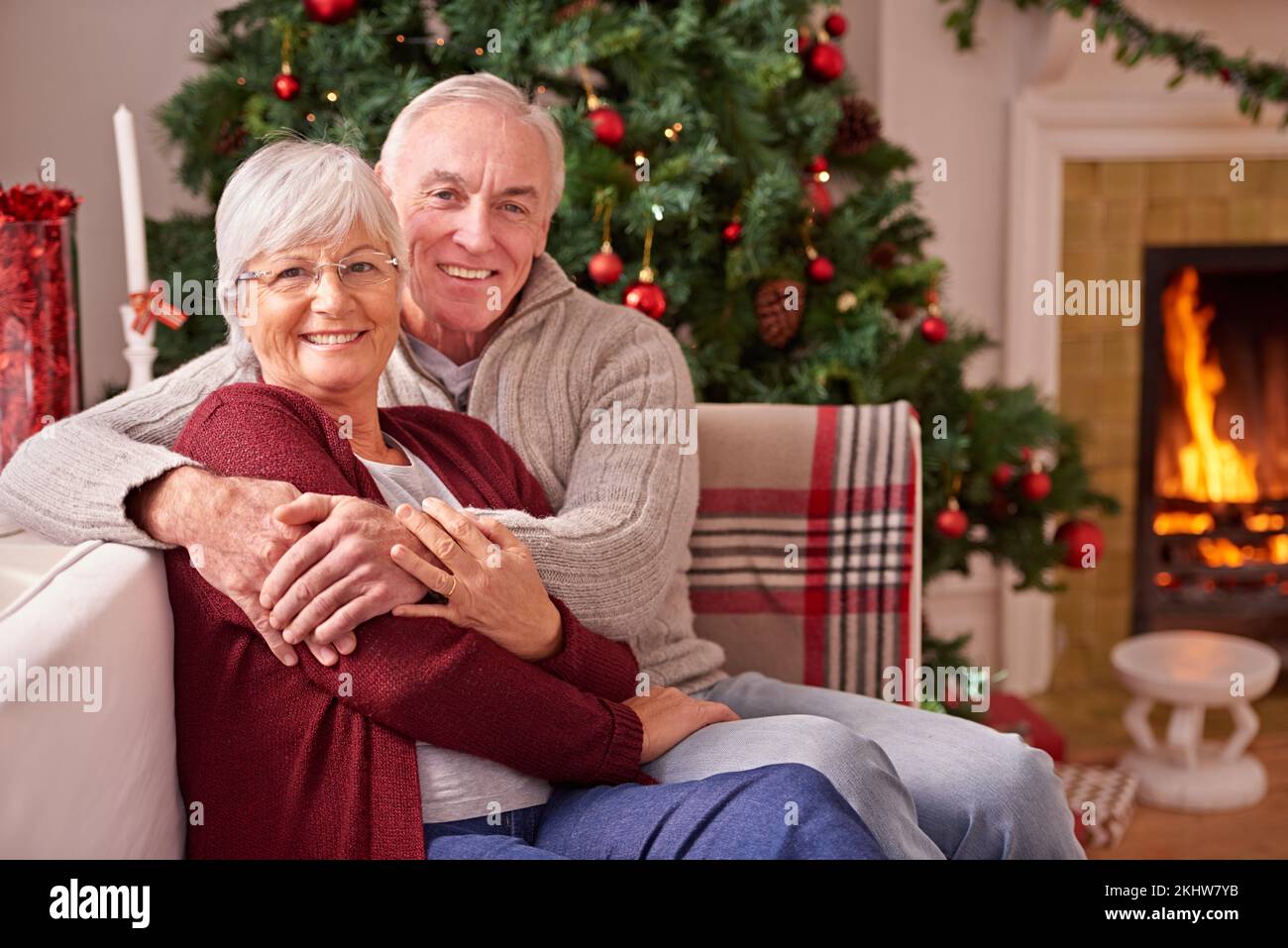 Christmas, senior couple and on couch together for happiness, festive ...