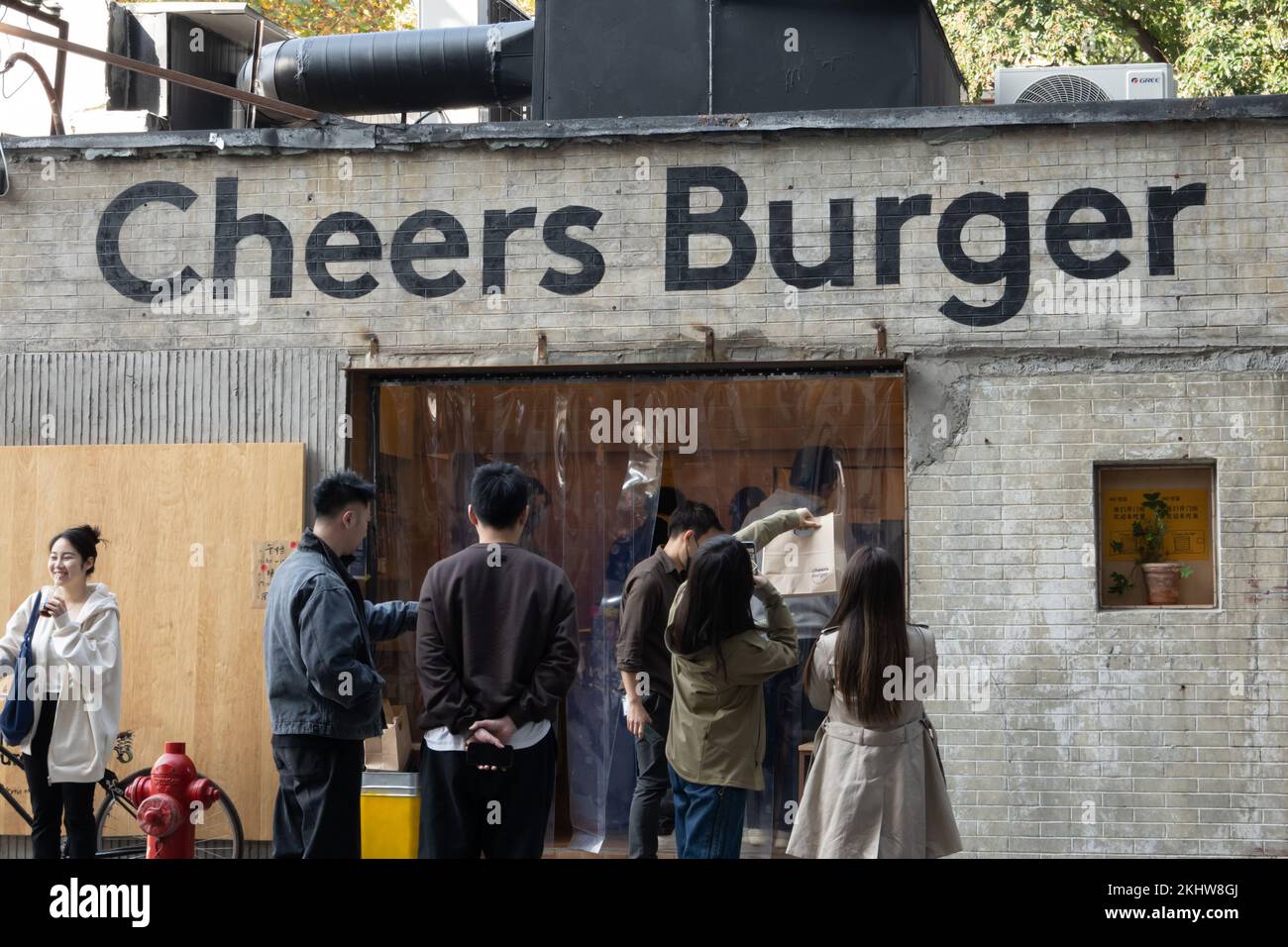 SHANGHAI, CHINA - NOVEMBER 24, 2022 - Cheers Burger shoppers gather in ...