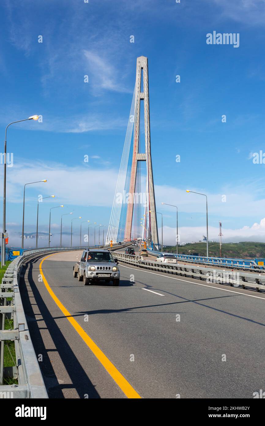 Cars drivind along the Cable-stayed Russky Bridge to island Russkiy in ...
