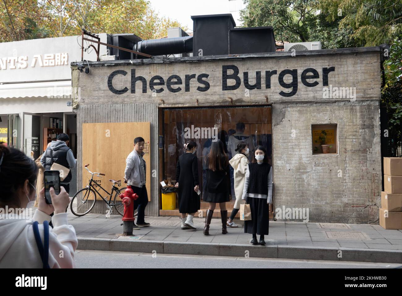 SHANGHAI, CHINA - NOVEMBER 24, 2022 - Cheers Burger shoppers gather in ...