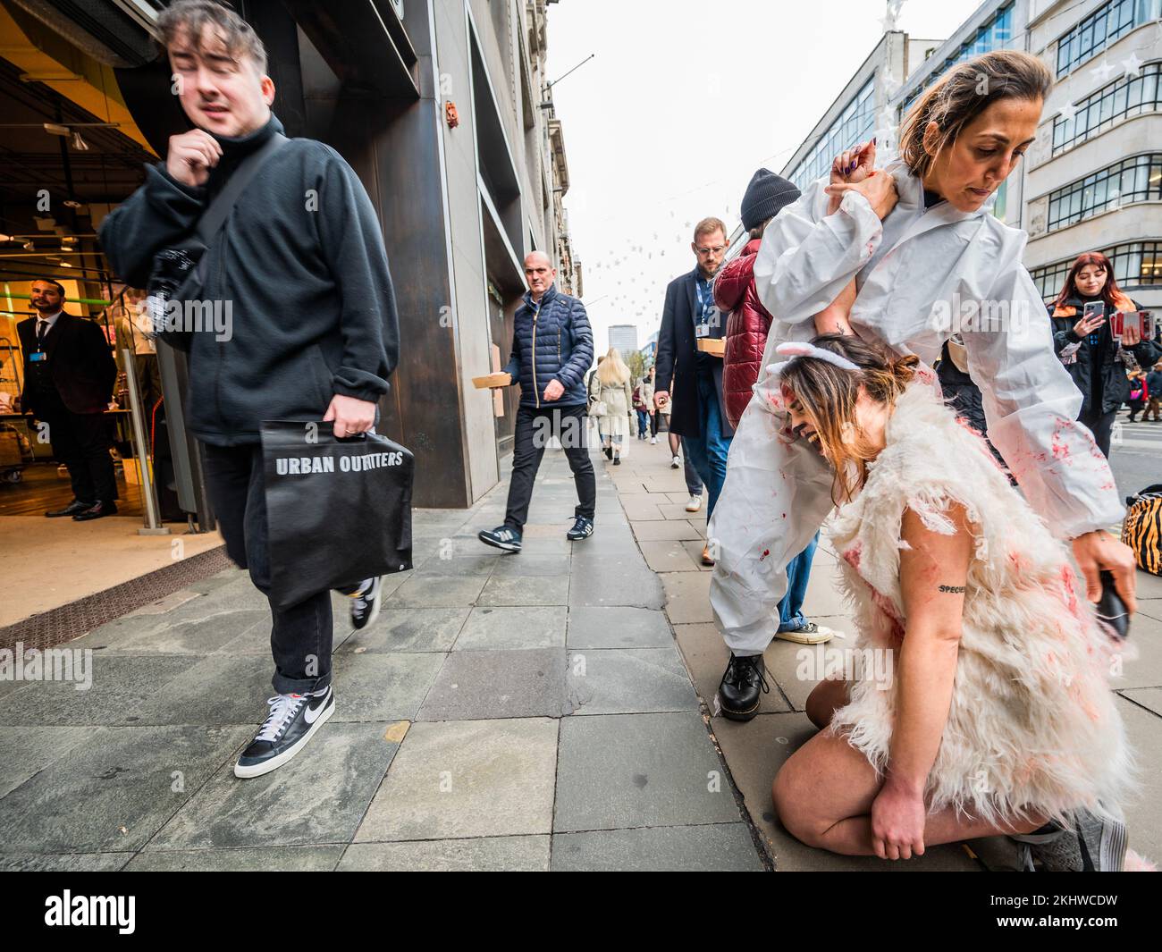 London, UK. 24th Nov, 2022. PETA supporter dressed as a “bloodied and ...