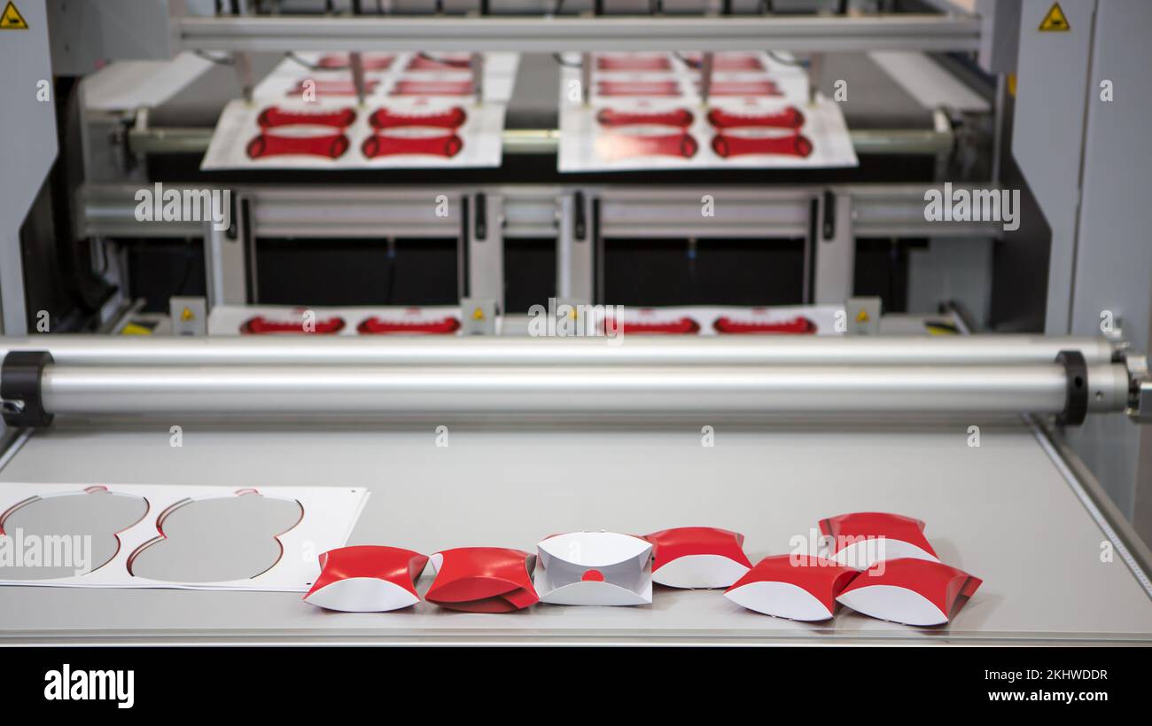 Digital cutting machine. Food folding packaging process on digital ...