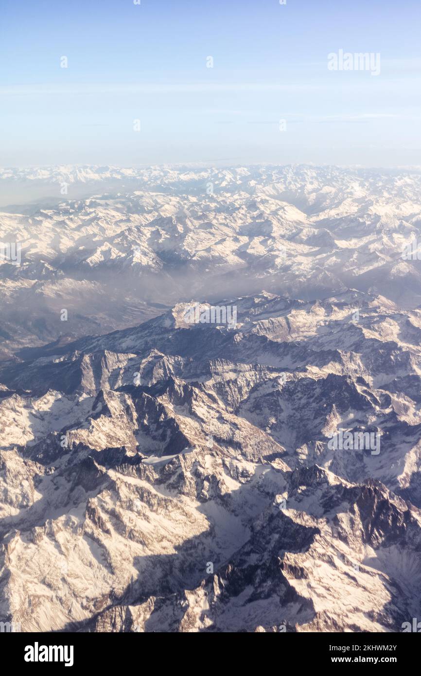 A vertical shot of the beautiful snow covered mountains. Aerial view of ...