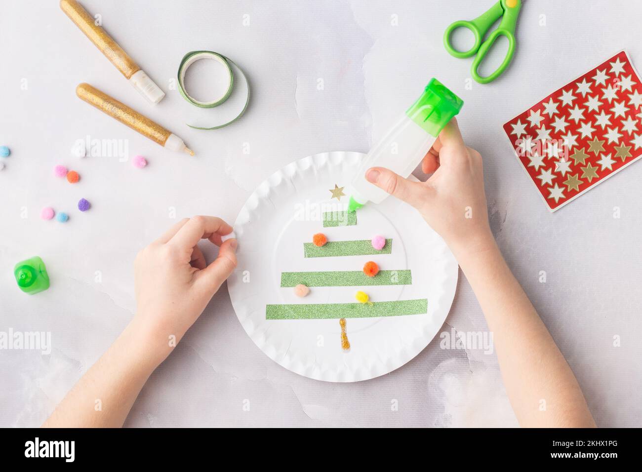 The child makes a greeting card Christmas paper collage. Made with his ...