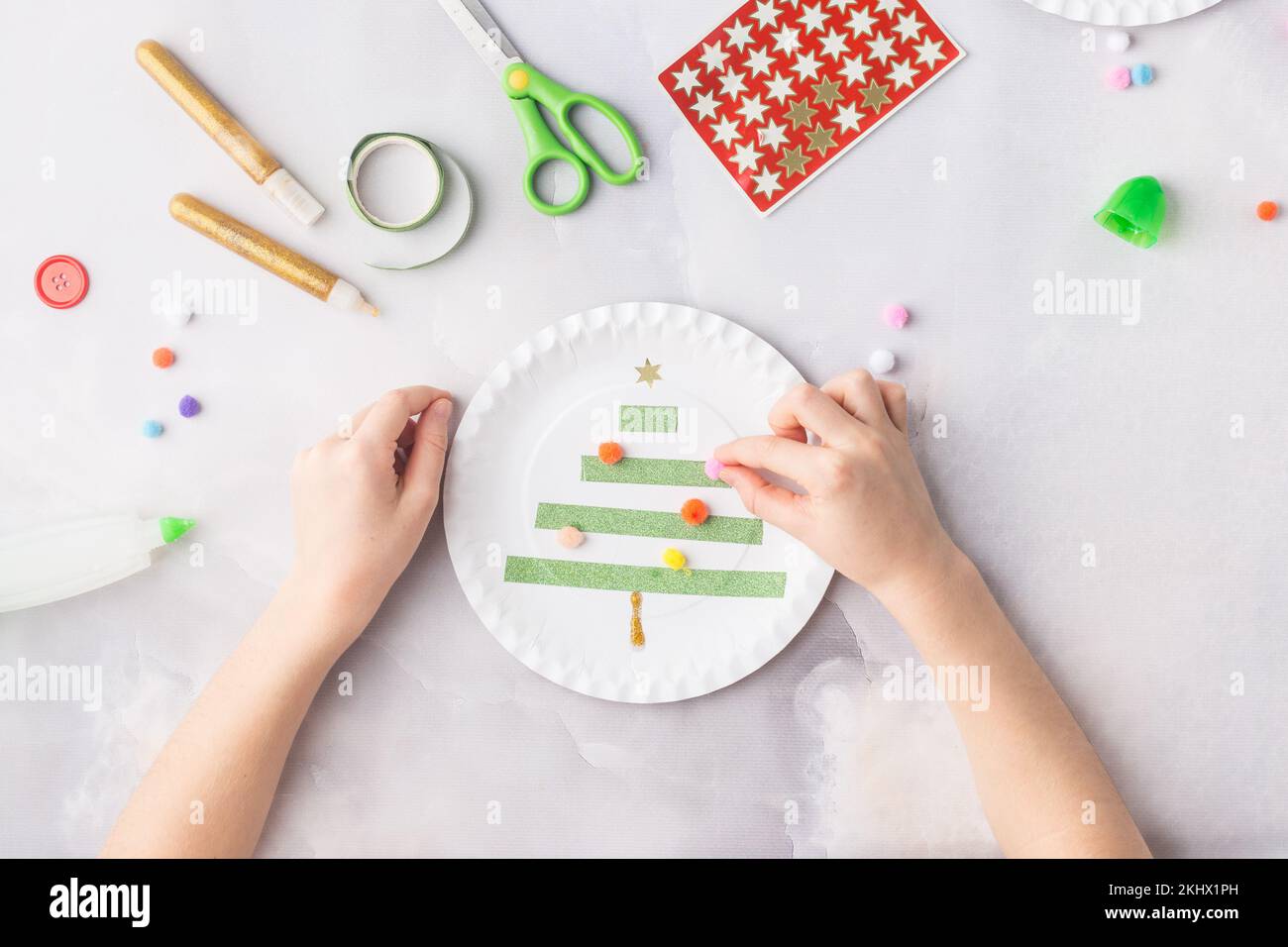 The child makes a greeting card Christmas paper collage. Made with his ...