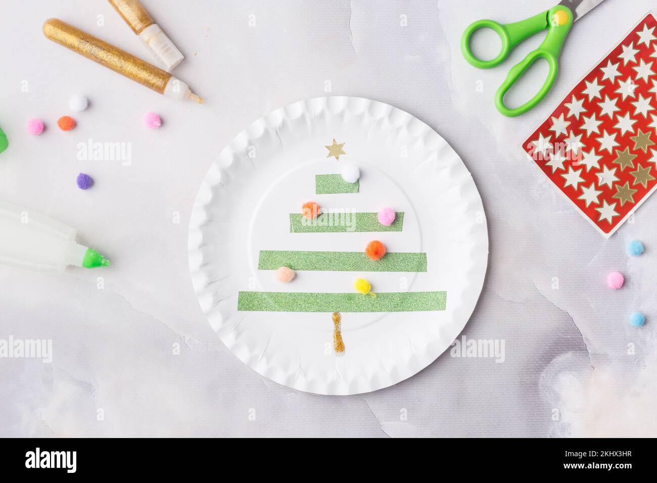 The child makes a greeting card Christmas paper collage. Made with his ...