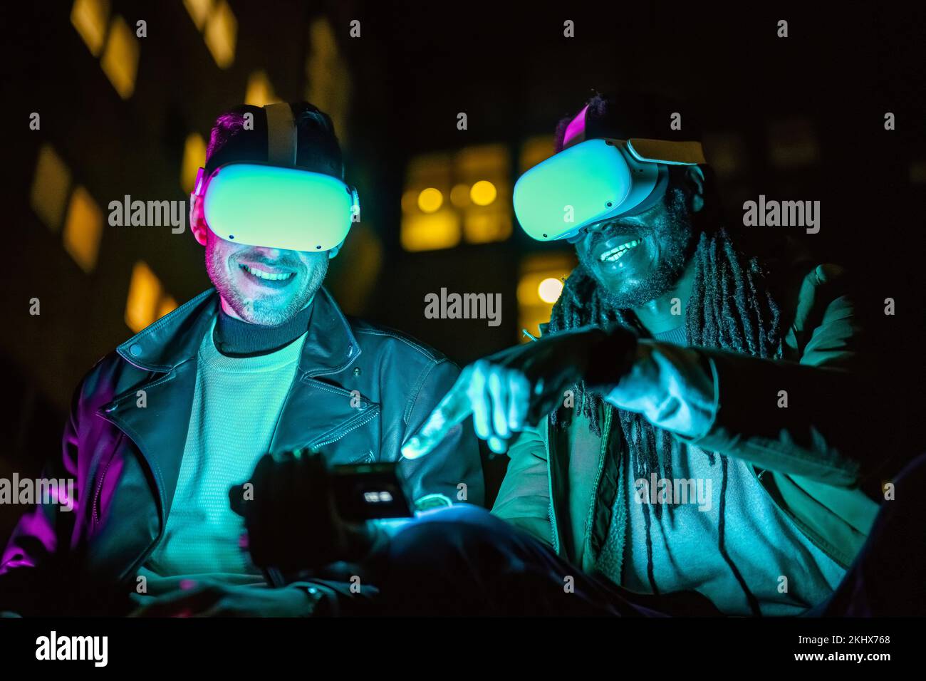 two men explore metaverse via headsets and augmented reality, using a ...