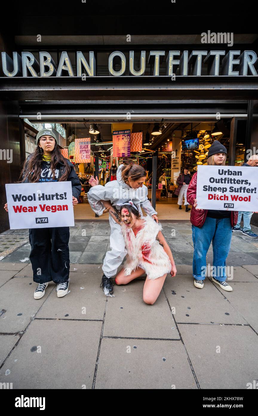 London, UK. 24th Nov, 2022. PETA supporter dressed as a “bloodied and ...