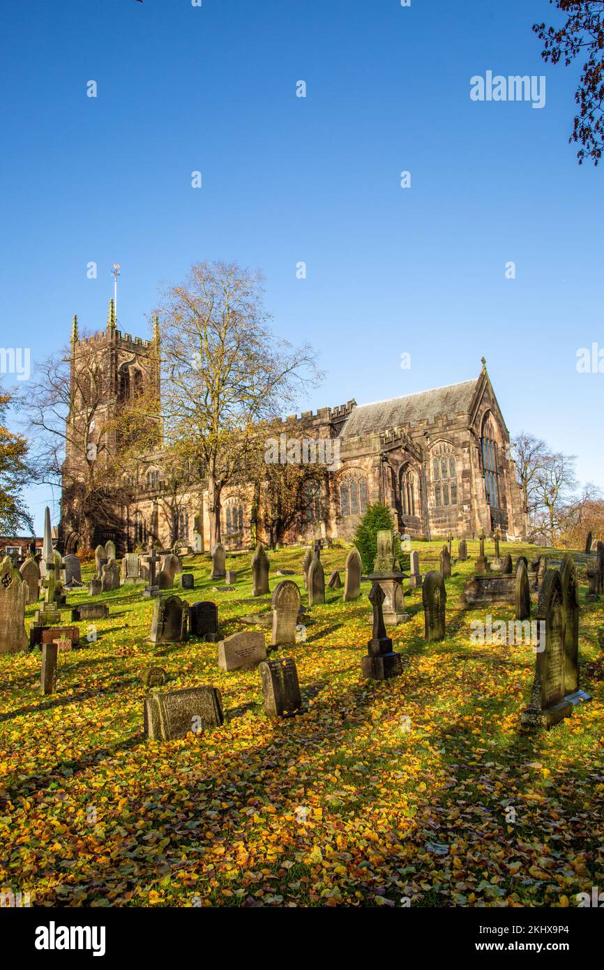 St Mary's parish church and churchyard during Autumn in the Cheshire ...