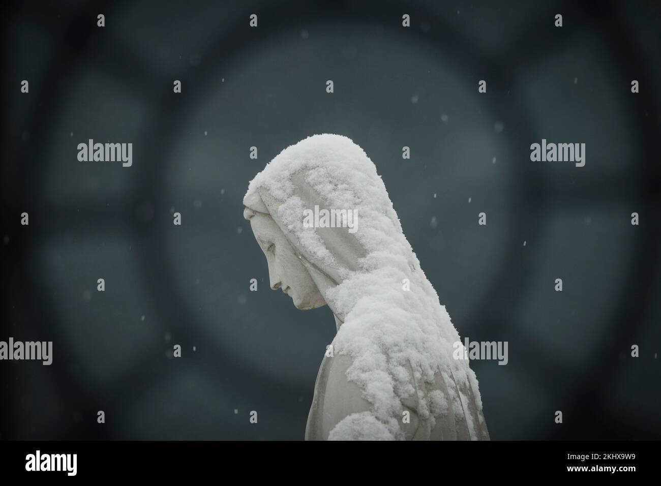 An efigy of the Virgin Mary is seen covered with snow in Warsaw, Poland ...