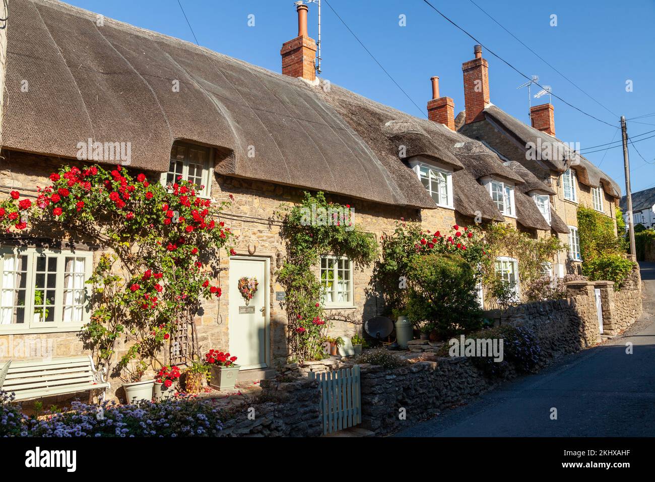 Traditional thatched houses in the beautiful village of Burton ...