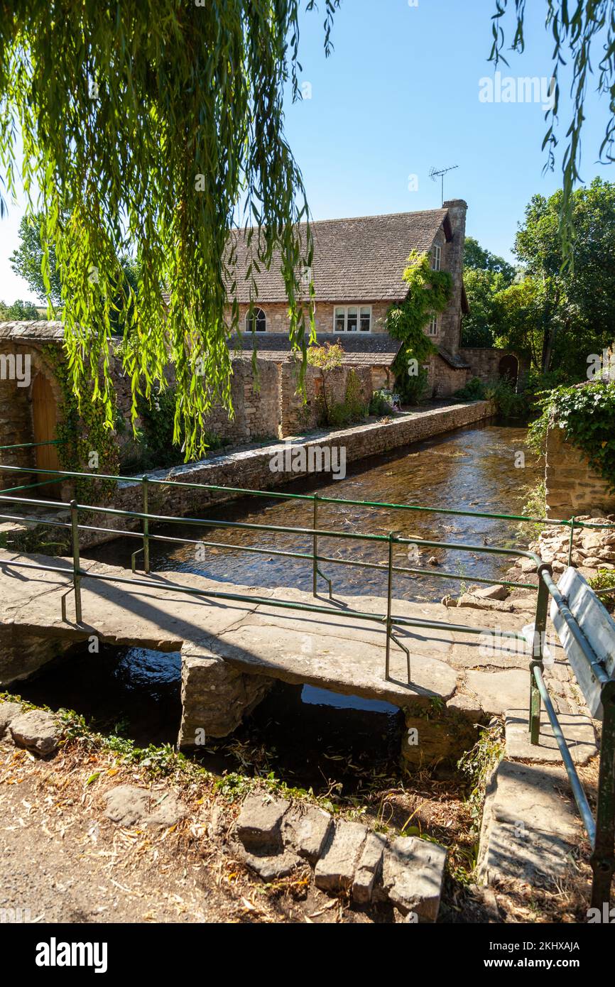 A small river in the Dorset Village of Burton Bradstock Stock Photo - Alamy