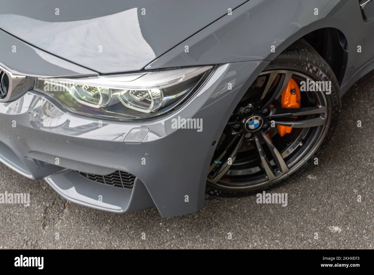 The BMW M4 Gray headlight and wheel view Stock Photo - Alamy