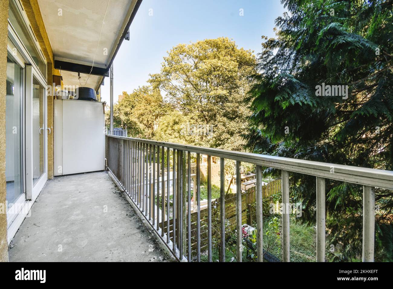 Narrow brick balcony with metal railings and door Stock Photo - Alamy