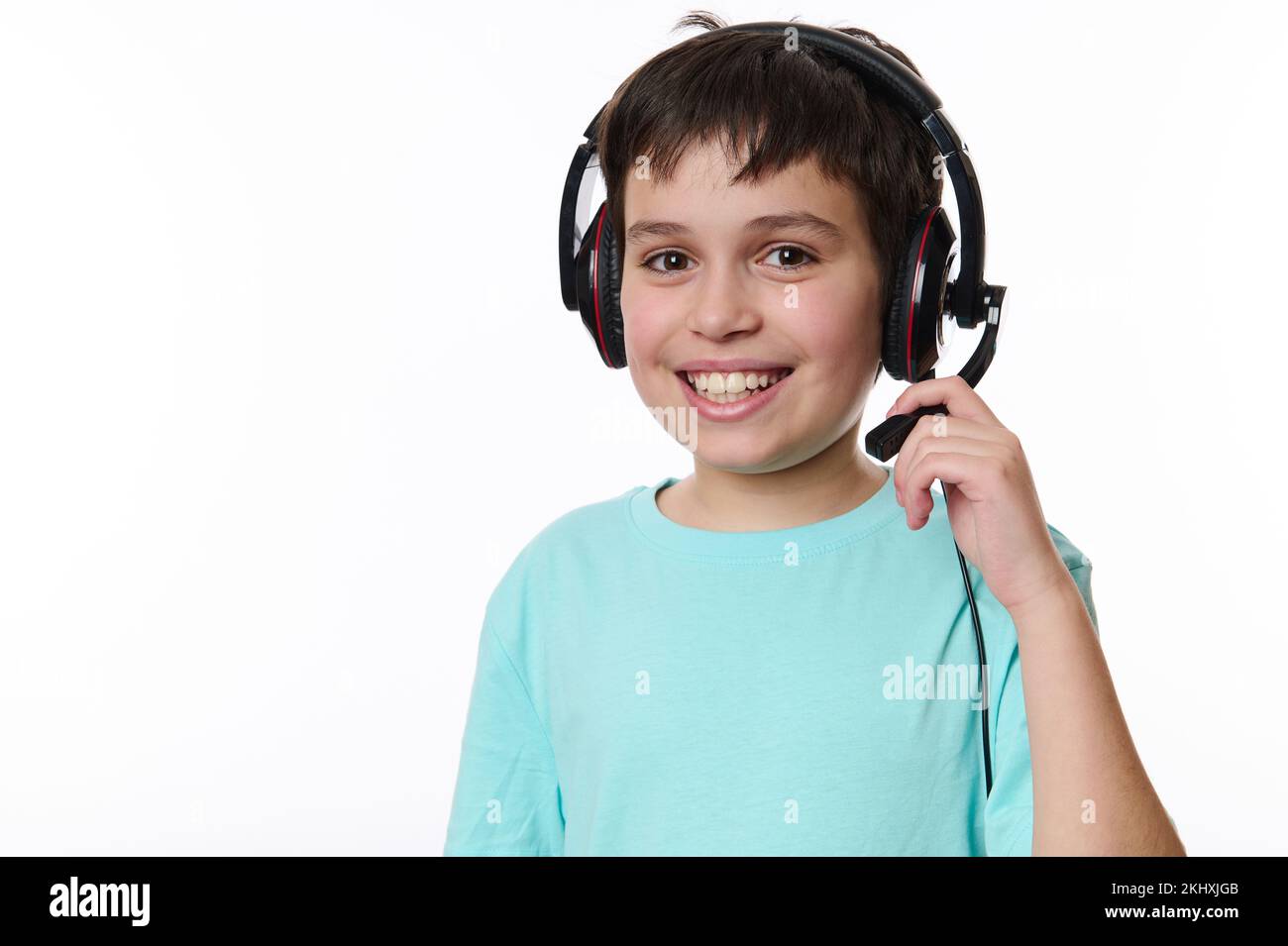 Smart teenage boy wearing audio headset, ready for online lesson ...