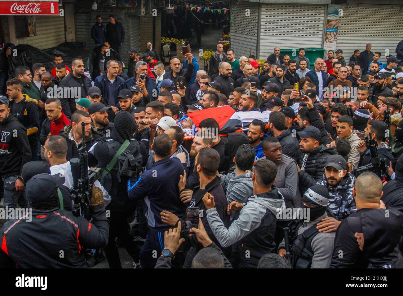 (EDITORS NOTE: Image depicts death)Mourners carry the body of one of ...