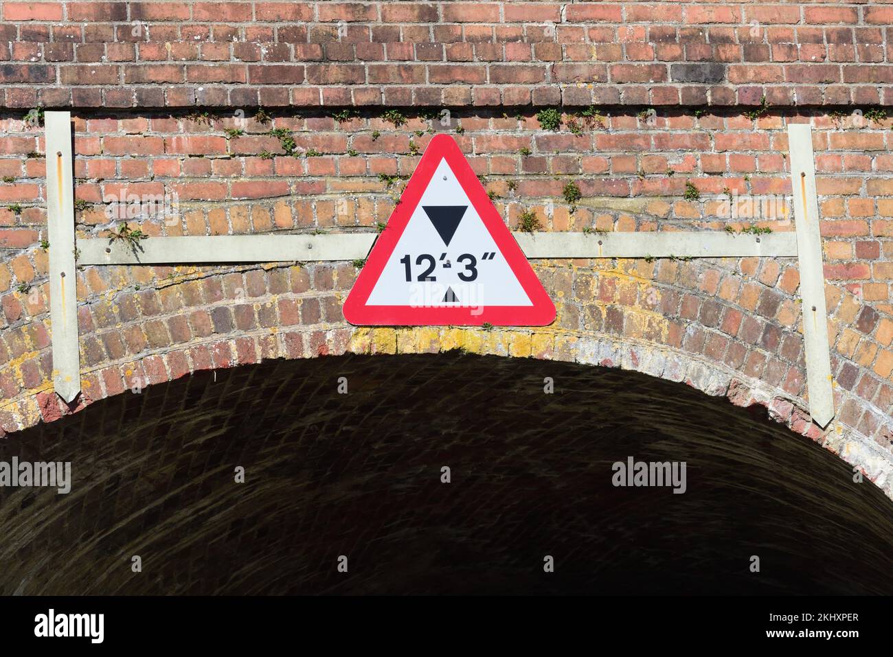 A railway bridge with limited headroom over a narrow country lane Stock ...