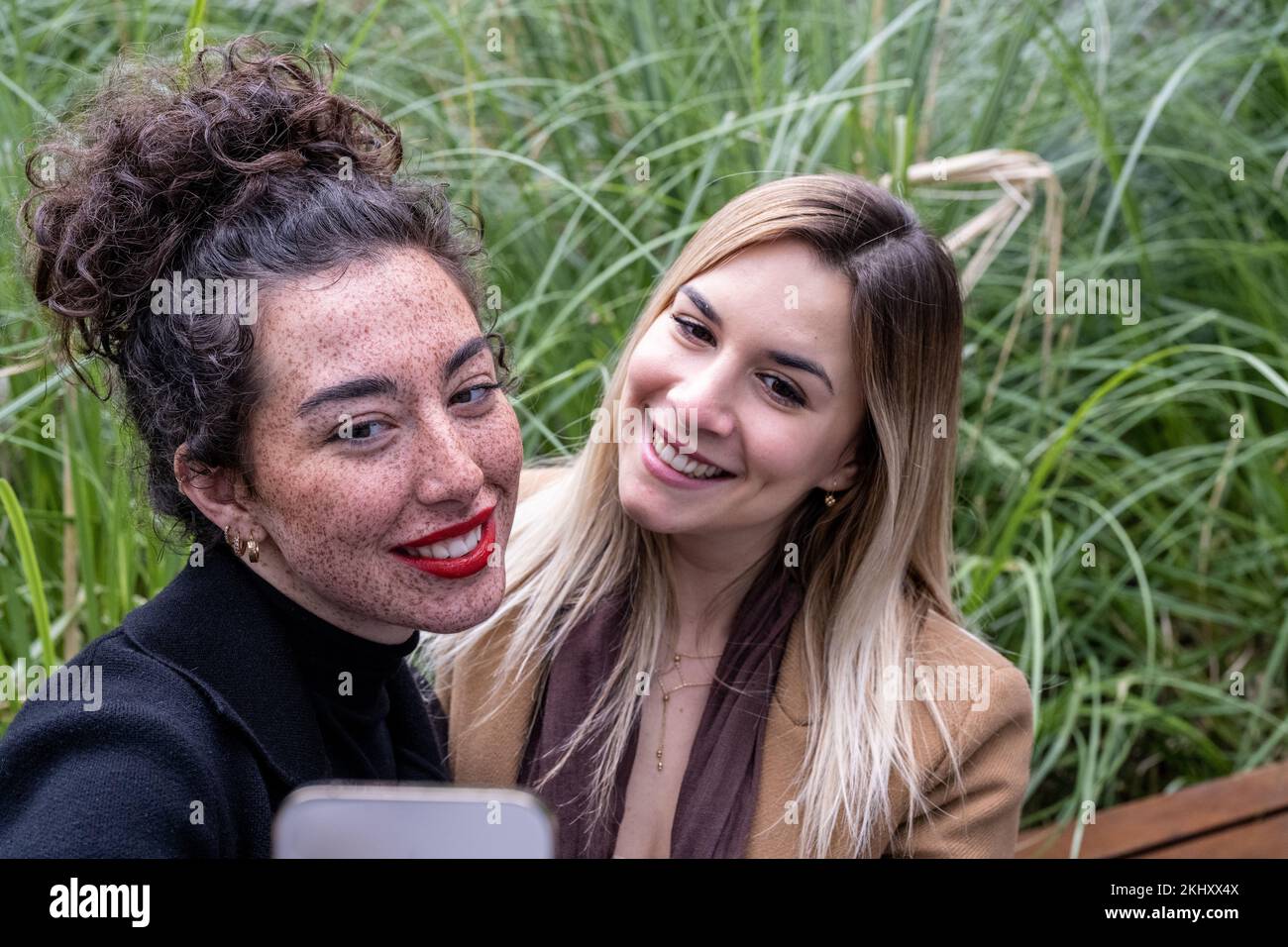Close up of a self portrait with two young business woman, diverse skin ...