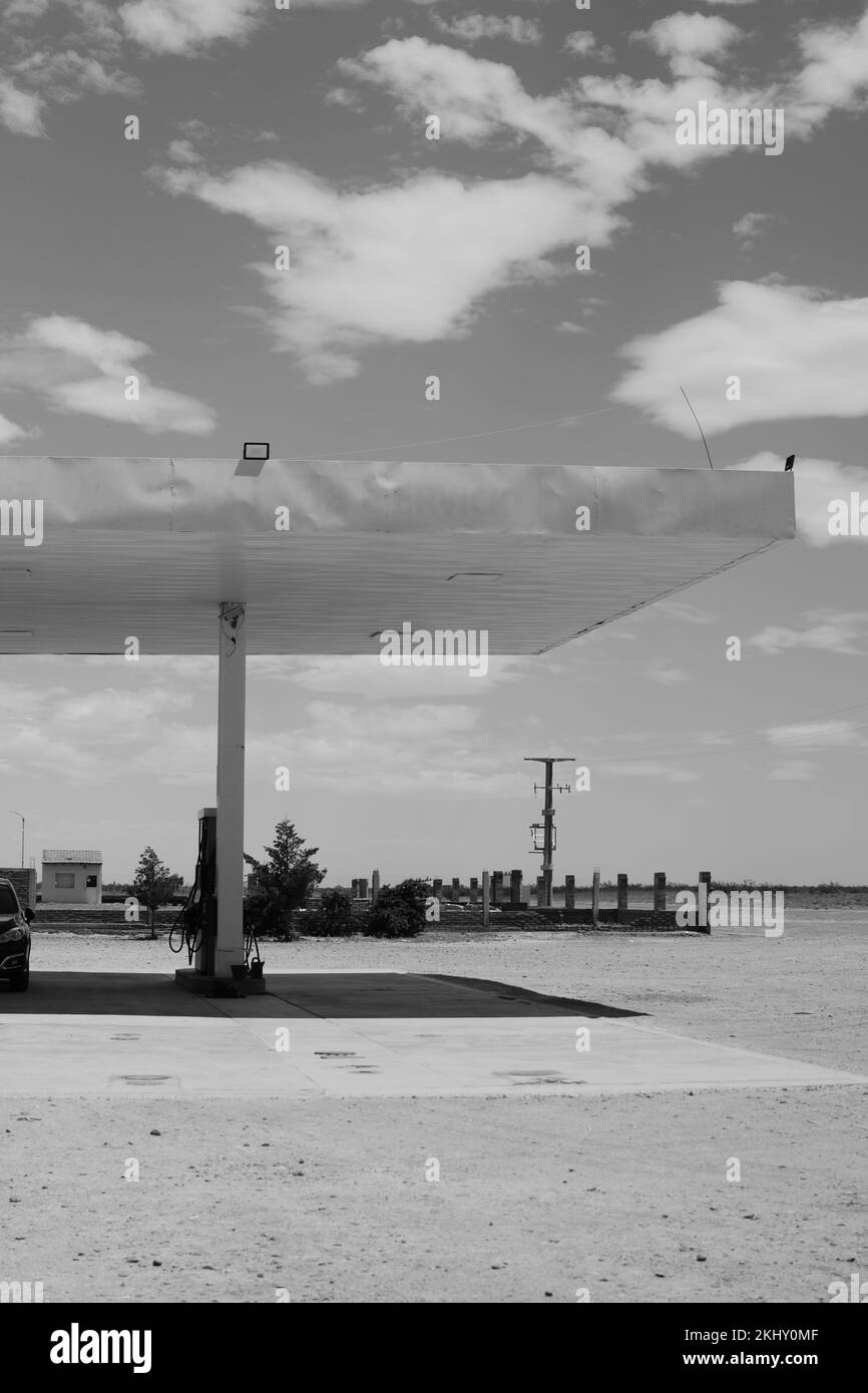 A vertical grayscale shot of an empty gas station Stock Photo - Alamy