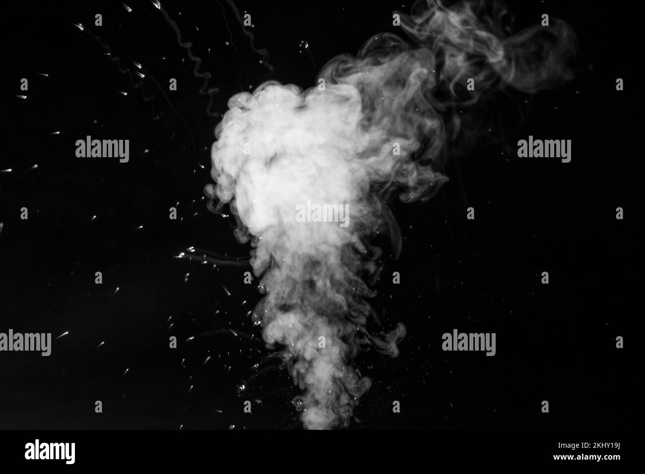 A jet of hot steam with splashes. The movement of hot steam with water ...