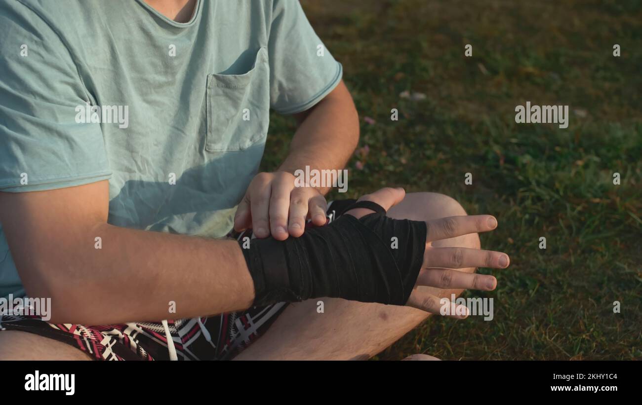A Caucasian young male practicing yoga outdoors Stock Photo - Alamy