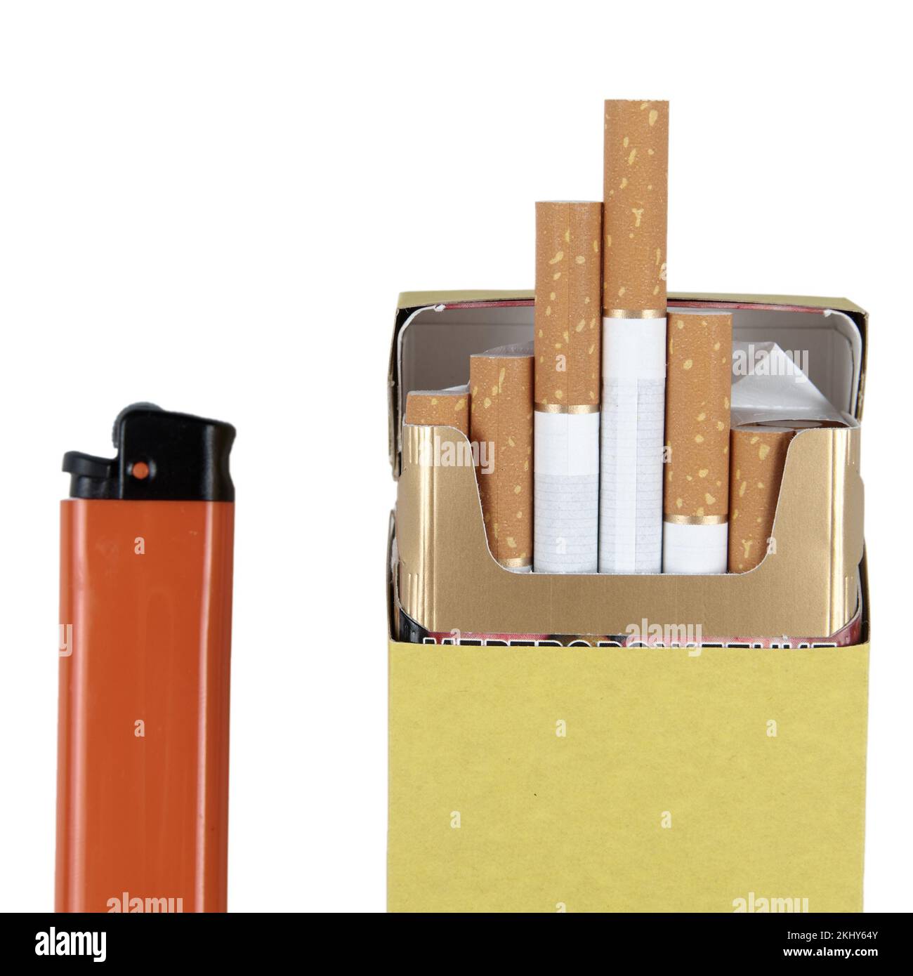 Yellow pack of cigarettes and orange plastic gas lighter isolated on ...