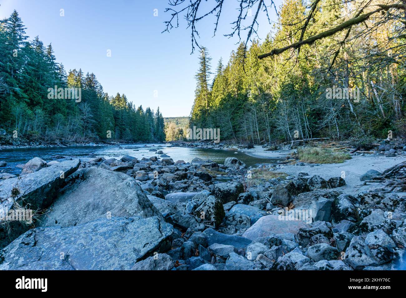 Large rocks line the Snoqaulmie River in Washington State Stock Photo ...